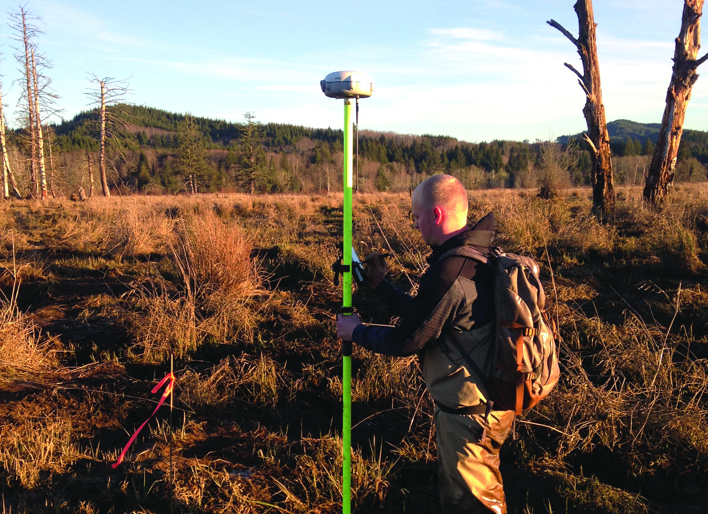 Mitch surveying targets - Columbia Land Trust